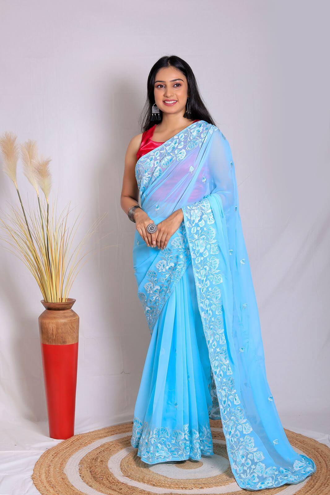 Sky Blue Georgette Saree With Beautiful Sequins Work And Embroidery